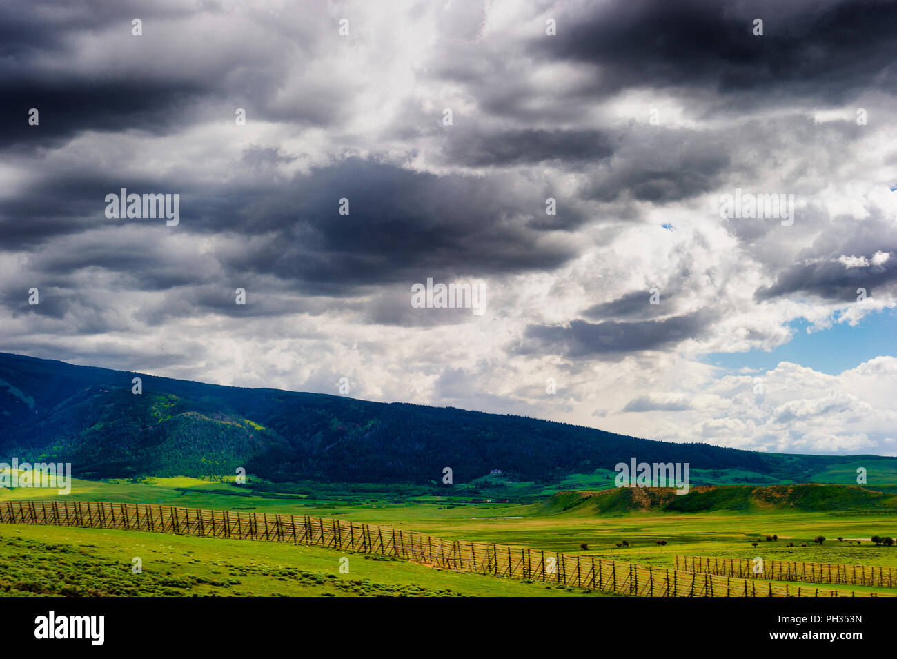 Views of Wyoming's ominous cloudy skies over open fields and sections ...