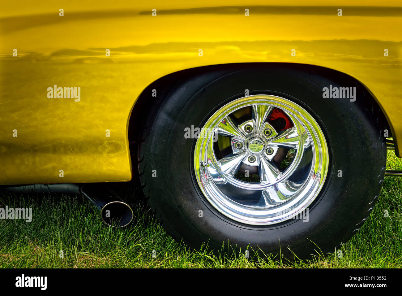 The rear end of an early 1970's American classic car in yellow Stock ...