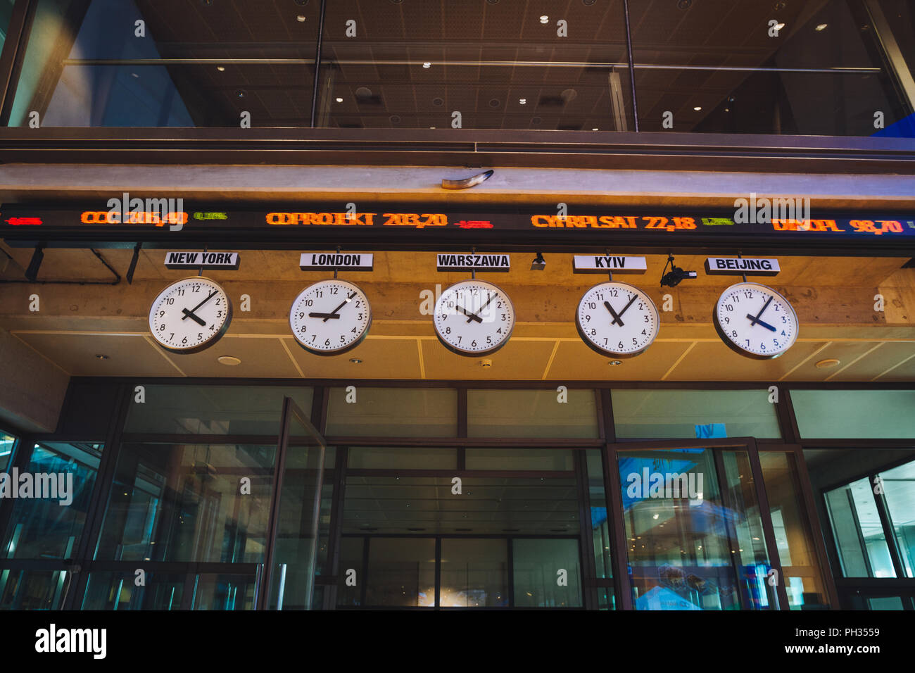Poland, Warsaw. August 17, 2018. Clocks display times in various time ...