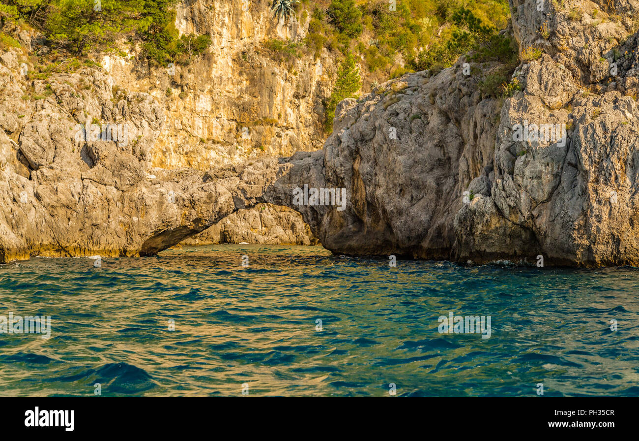 Rocky Arch on the Sea in Italy Stock Photo - Alamy