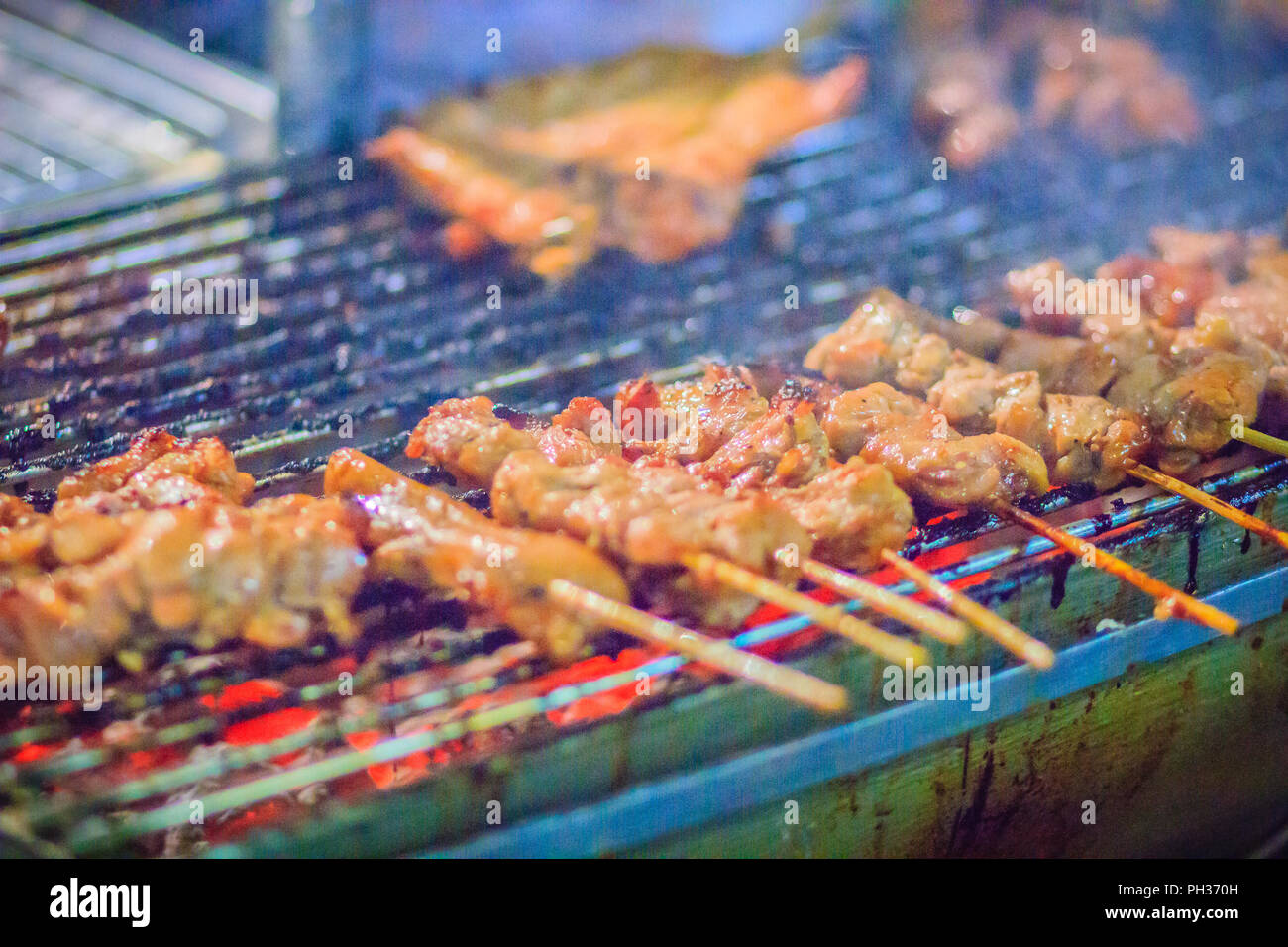 Close up of satay stall in bangkok market hi-res stock photography and ...