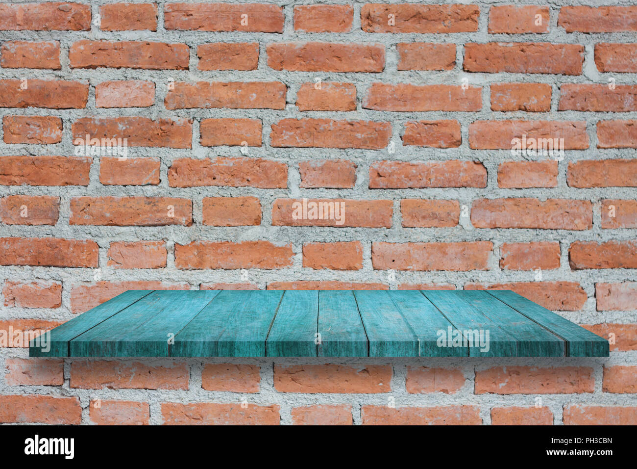 Top of blue wooden shelf on brick wall. For product display Stock Photo ...