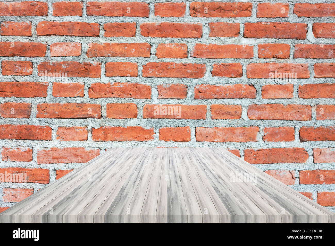 White table top on brick wall. For product display Stock Photo - Alamy