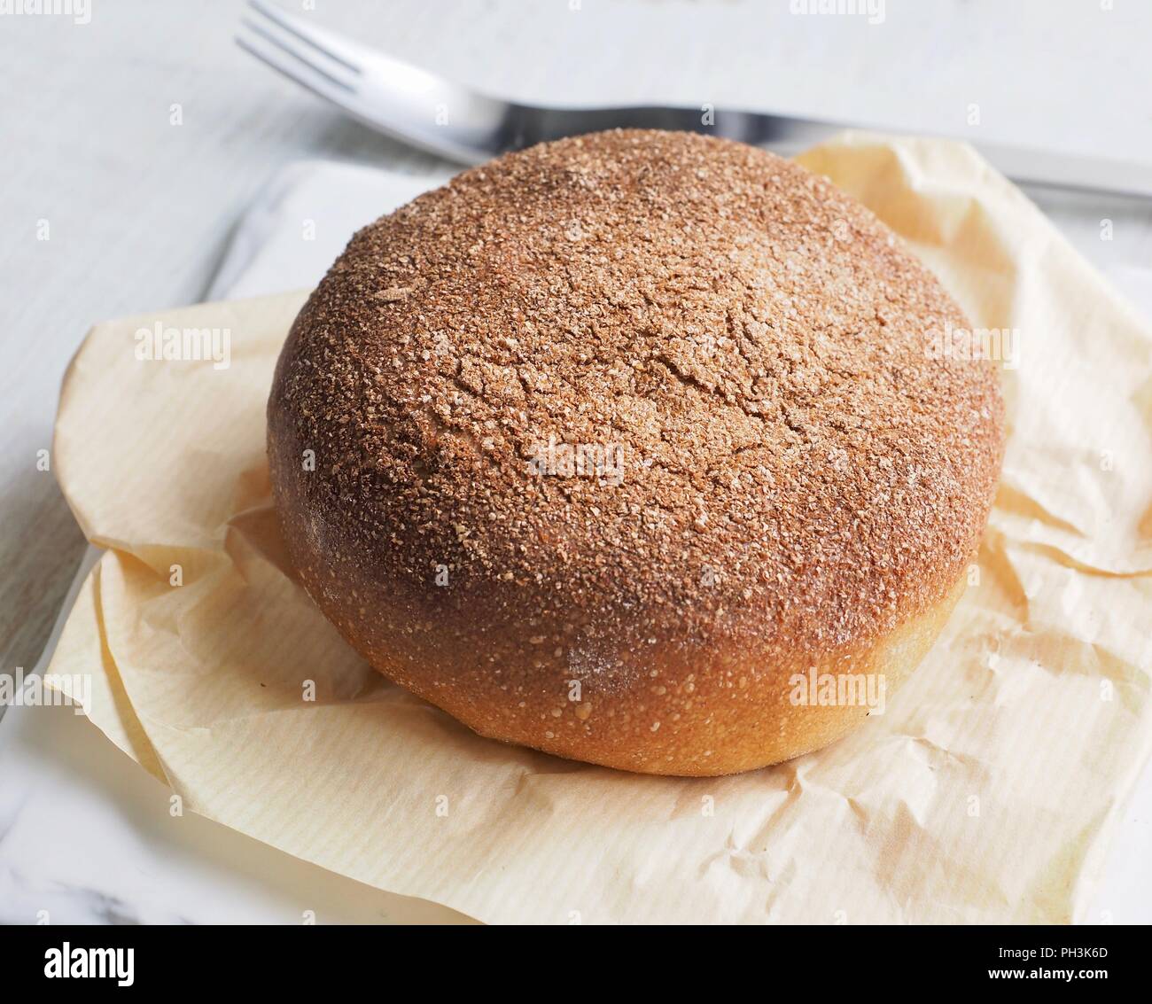 Whole-wheat bread baked in the oven Stock Photo - Alamy