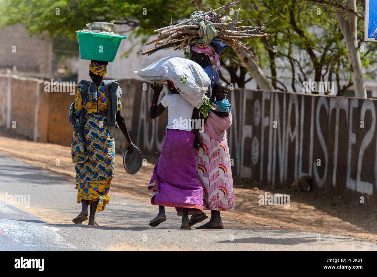 KAYAR, SENEGAL - APR 27, 2017: Unidentified Senegalese women in colored ...