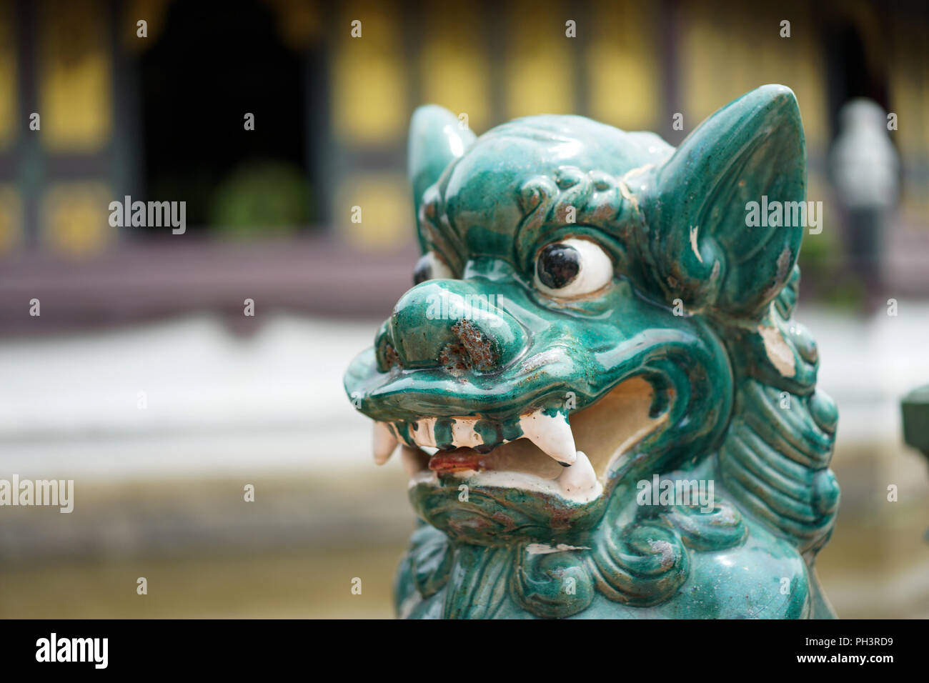 Asia green creature like lion - dragon statue, it's big eye, nose, ear ...