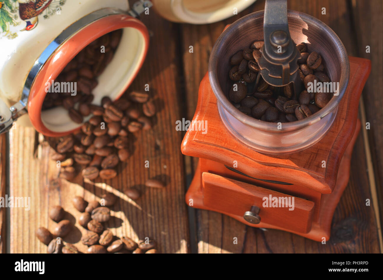 A handmade coffee grinder with coffee beans, coffee roasted grains ...
