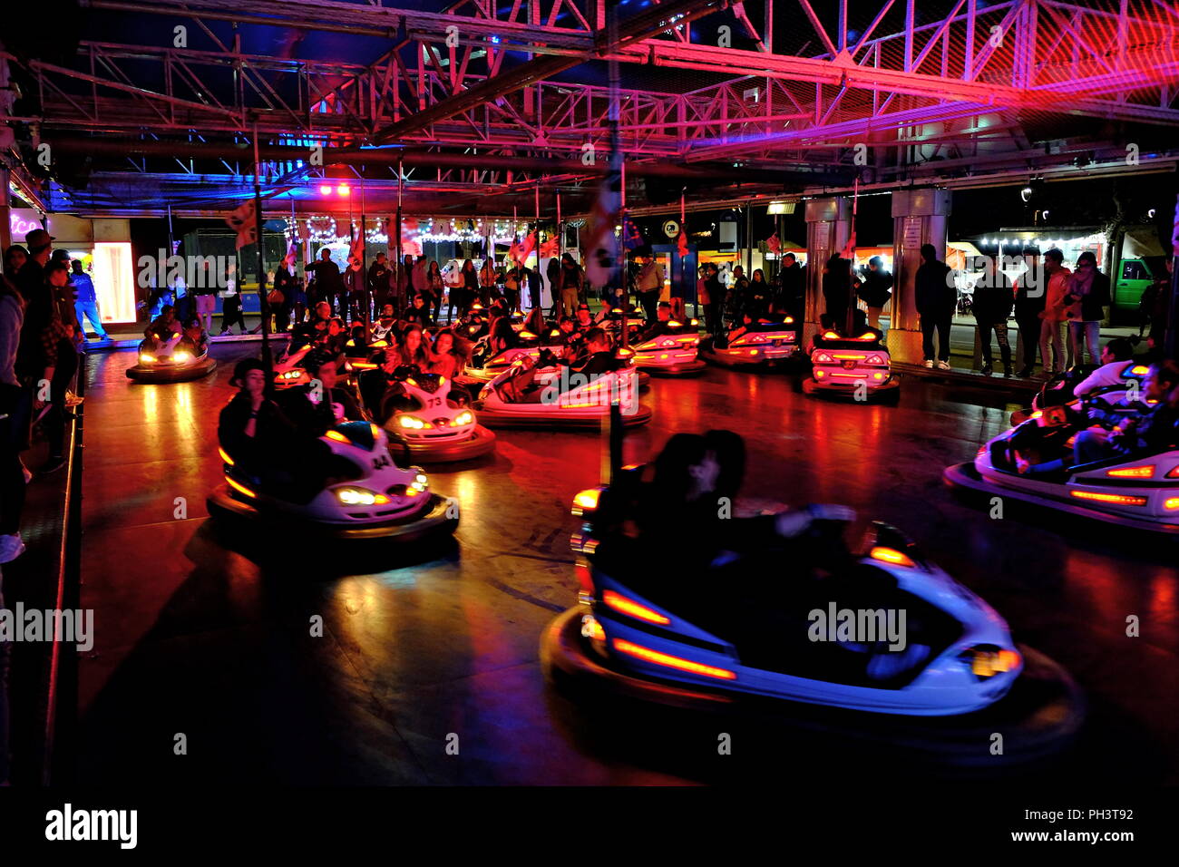 people playing on bumper cars Stock Photo - Alamy