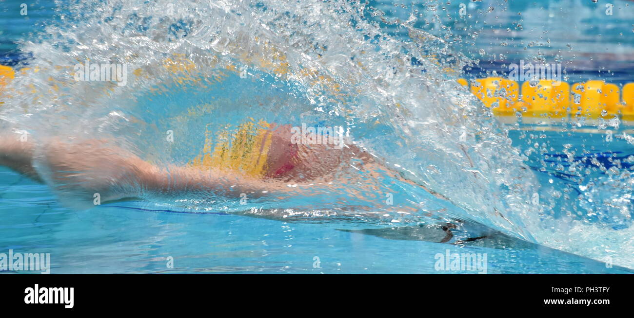 Man compete in swimming pool. Man swimming backstroke. Swimmer in ...