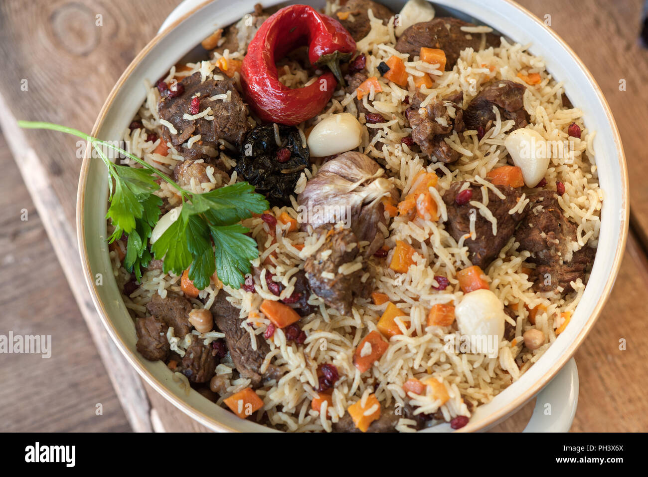 Basmati rice with garlic, prunes, carrots, parsley and beef Stock Photo ...
