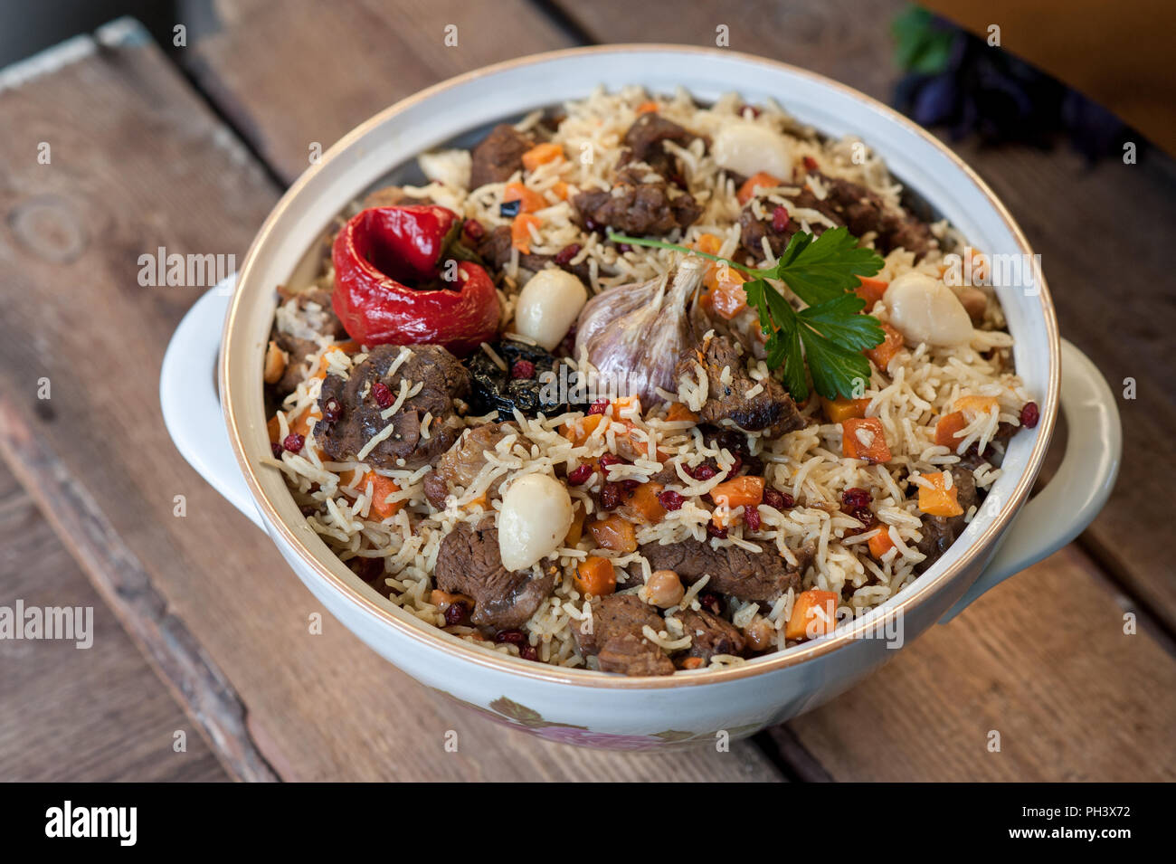 Basmati rice with garlic, prunes, carrots, parsley and beef Stock Photo ...