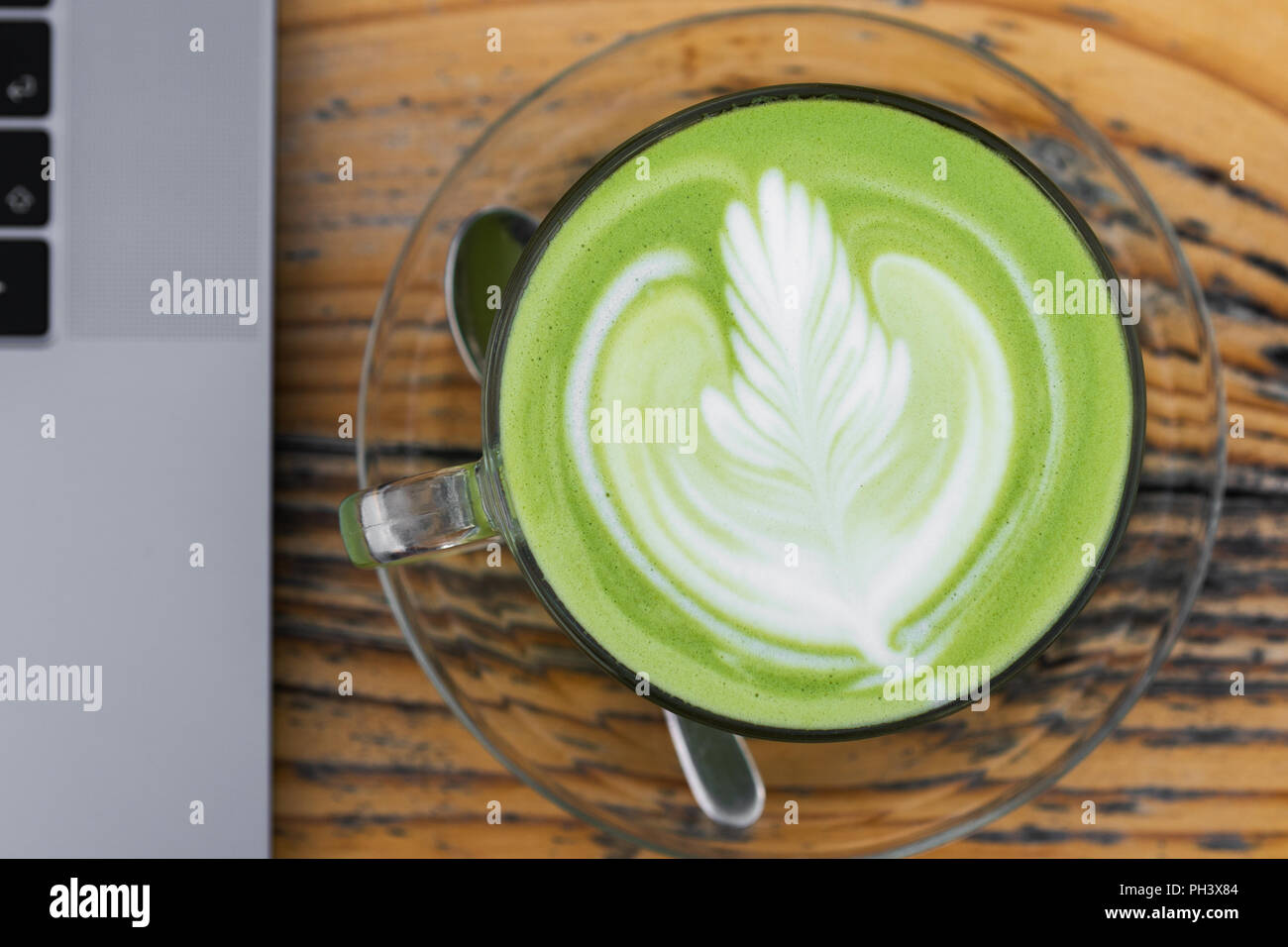 a cup of hot milk green tea on a table Stock Photo - Alamy