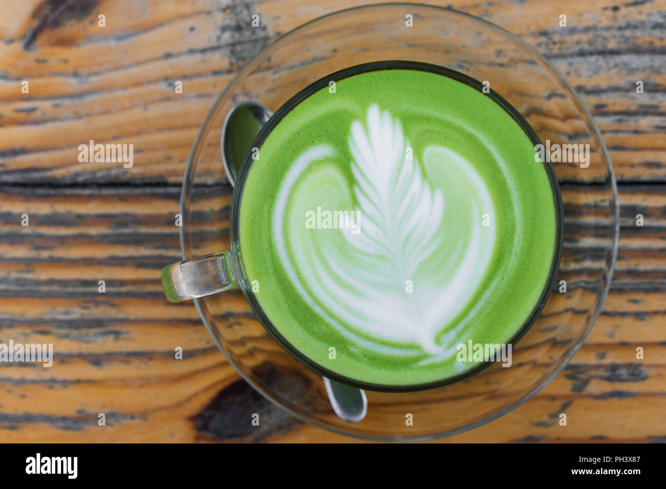 a cup of hot milk green tea on a table Stock Photo - Alamy