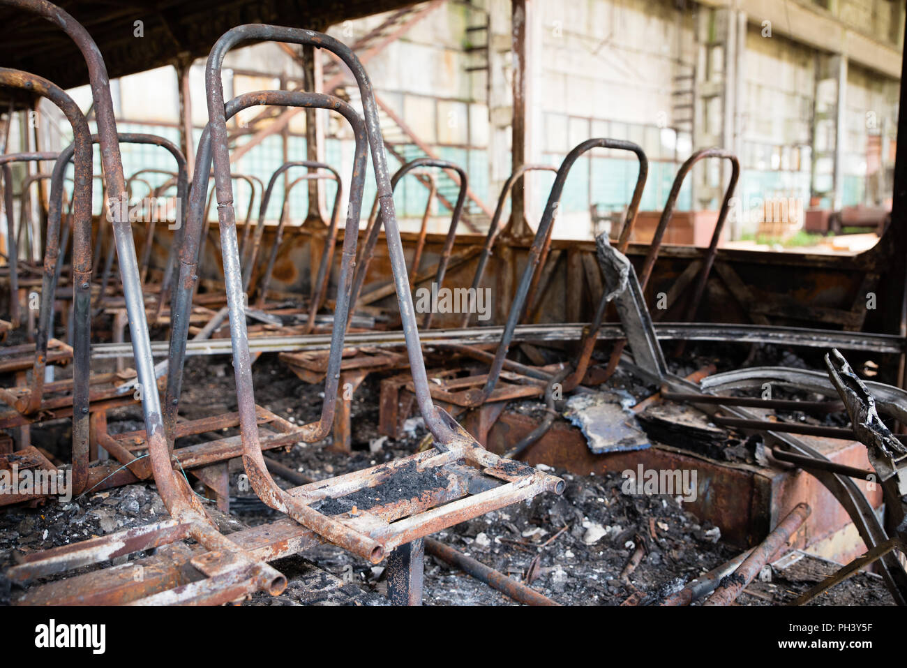 Consequences of a fire in the bus, accident. Scorched passenger seats ...