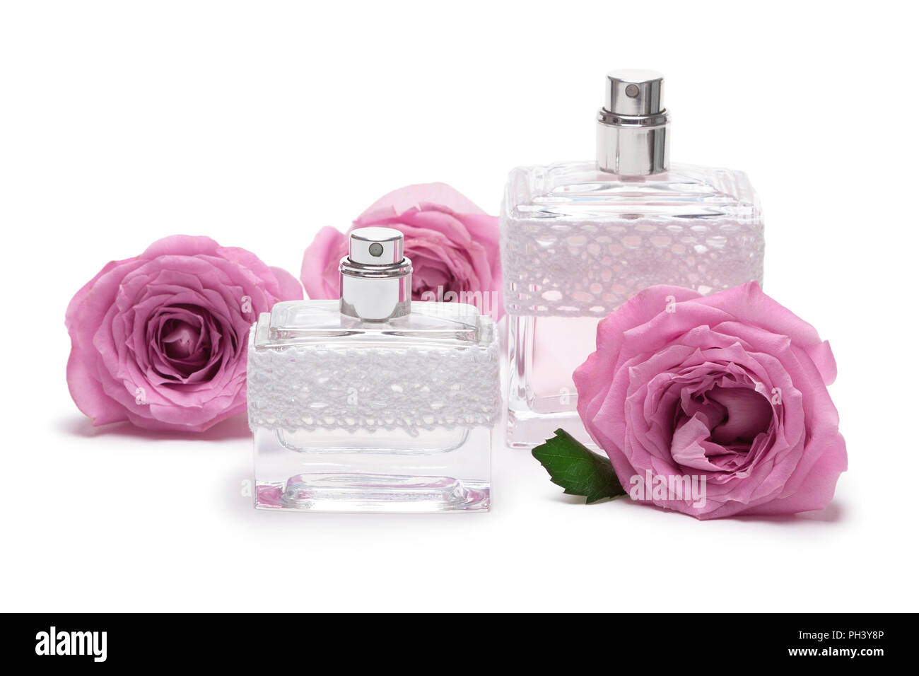 Two perfume bottles with roses on white background Stock Photo - Alamy