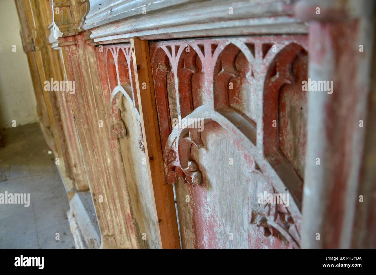 Wooden reredos showing original paint inside All Saints' Church ...