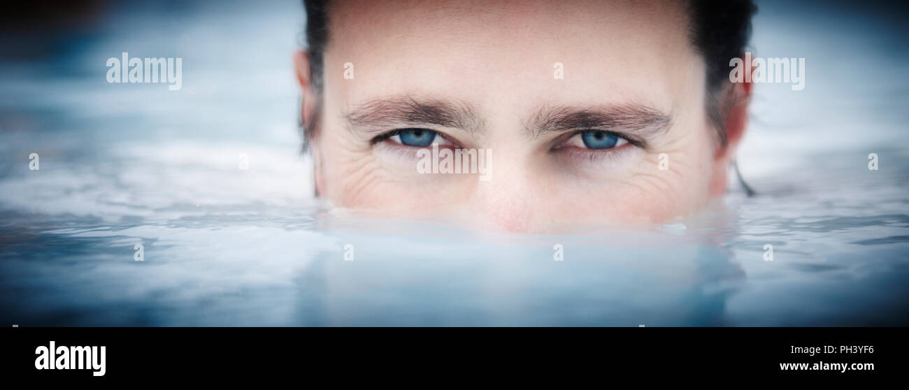 Man with blue eyes in blue water Stock Photo - Alamy