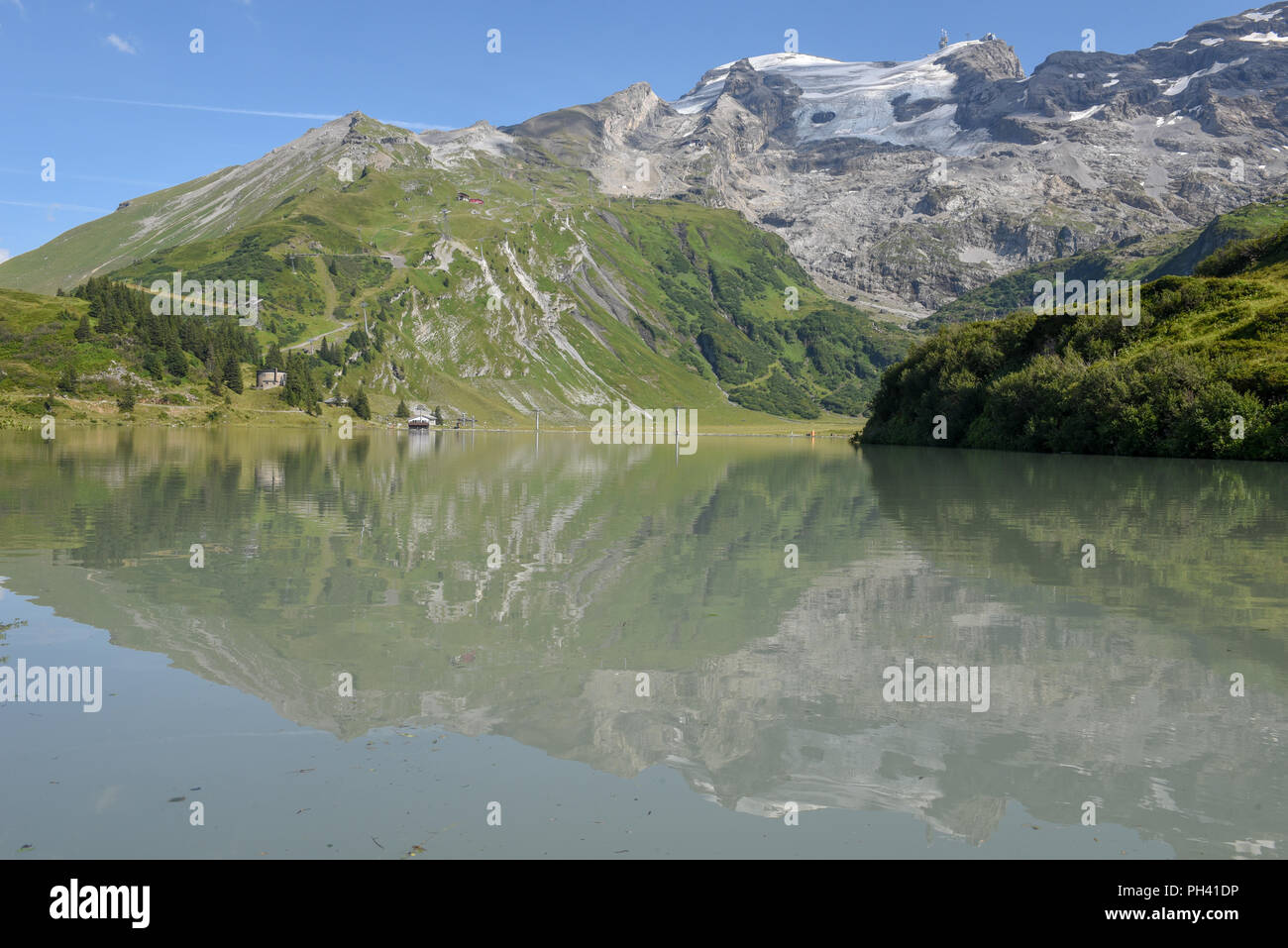 Lake Truebsee and mount Titlis glacier over Engelberg on the Swiss alps ...