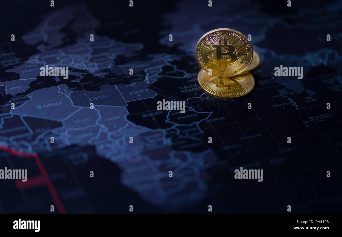 Cryptocurrency coin gold on blurred map world background Stock Photo ...