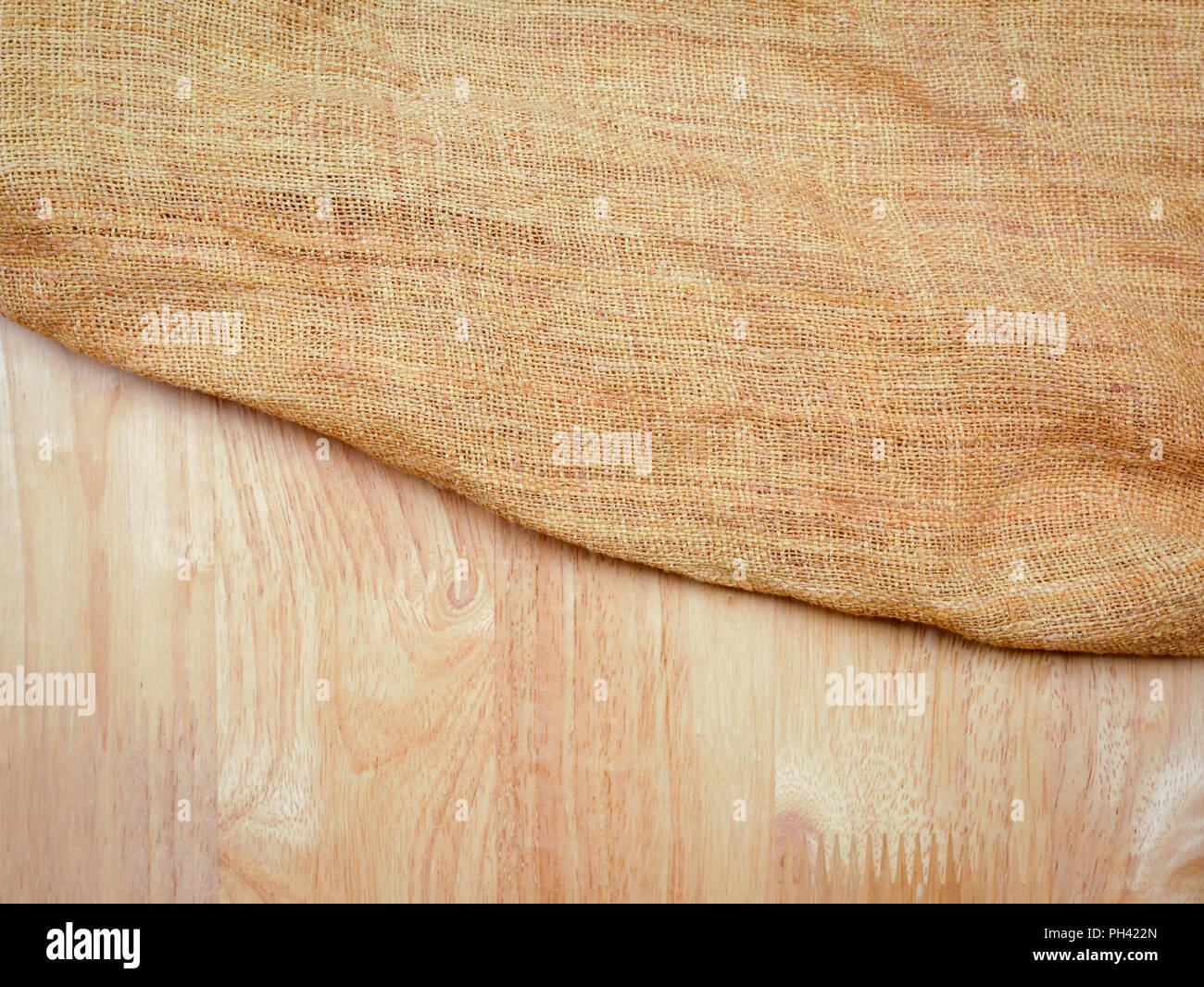 texture background Wood table with old sackcloth burlap tablecloth ...