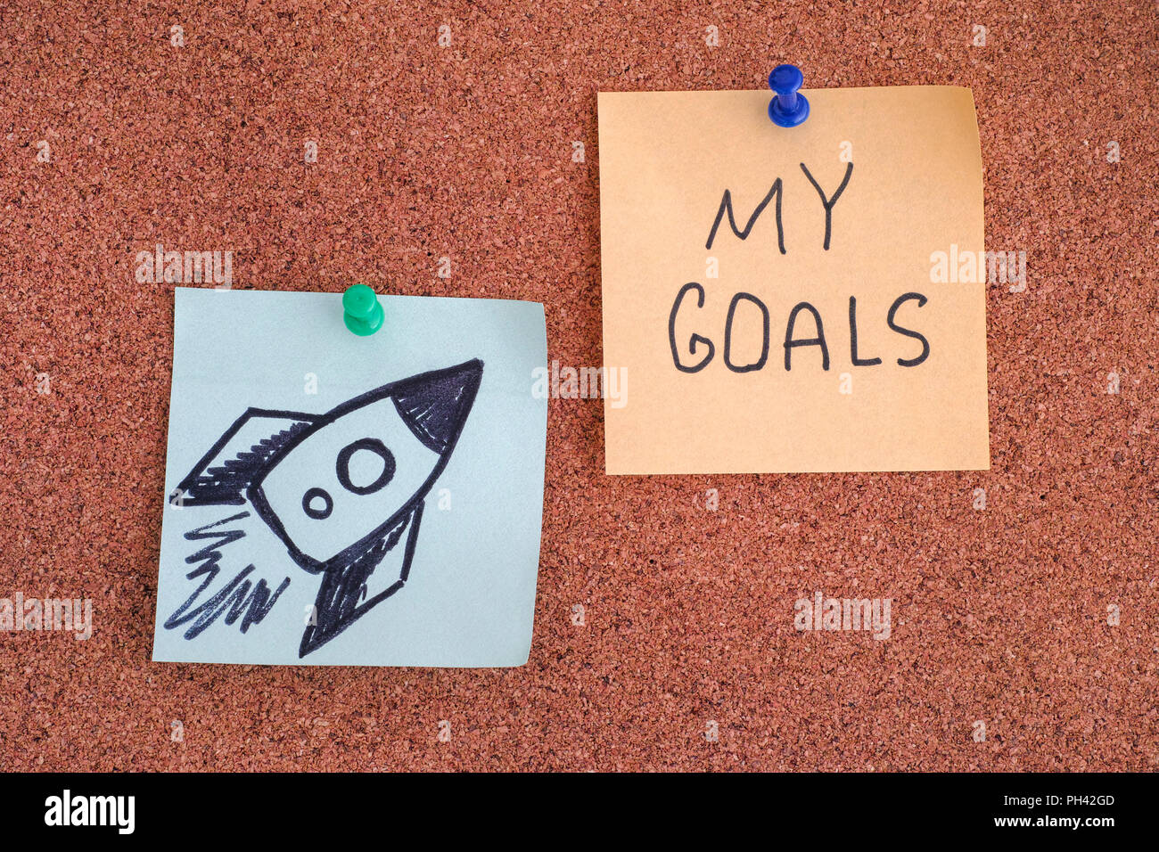 Post it Notes with Space Rocket and words My Goals on bulletin board ...