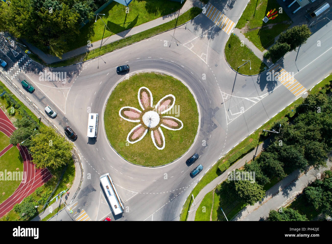 Top view of the road with a circular motion and a flower bed. Aerial ...
