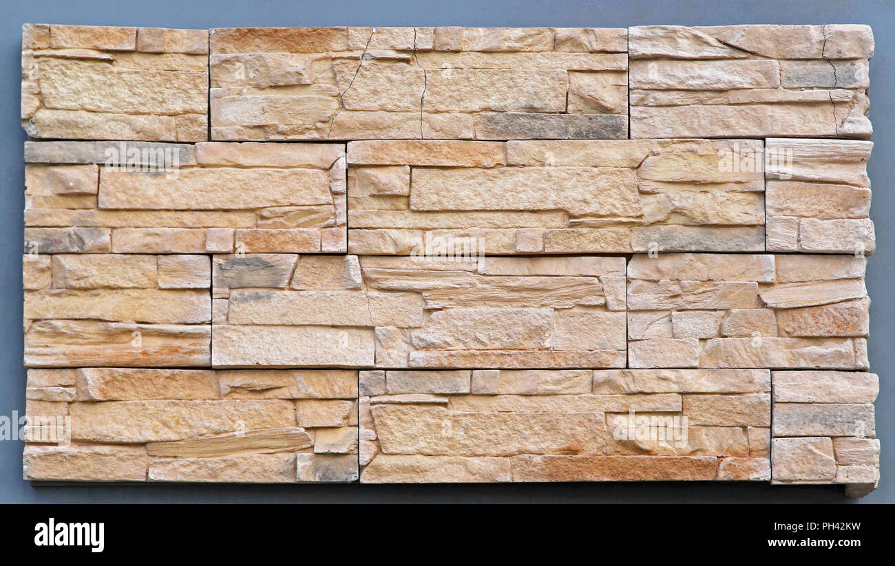 Vintage style natural beige stone brick wall Stock Photo - Alamy