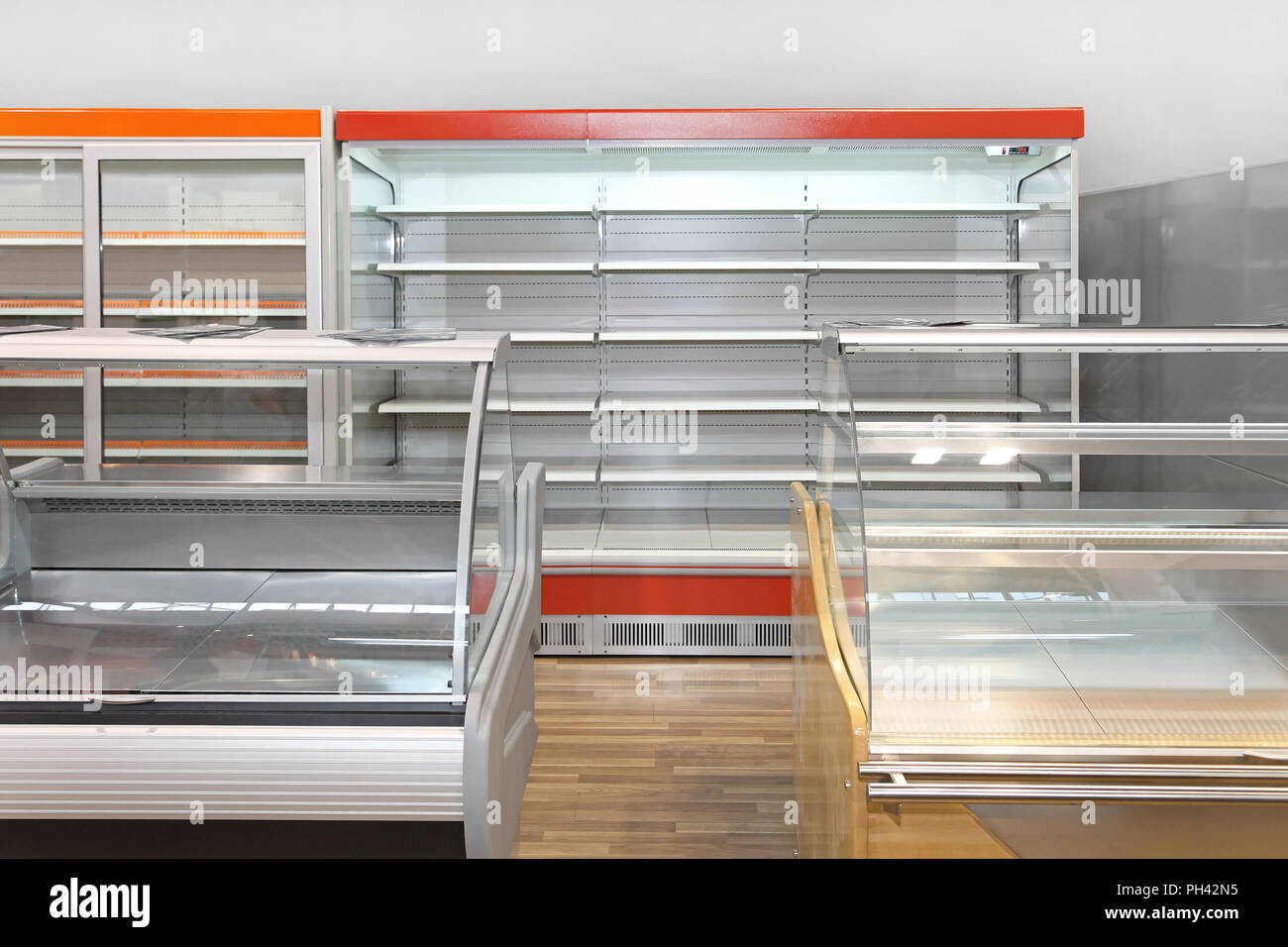Empty retail shelves and showcases in grocery store Stock Photo - Alamy