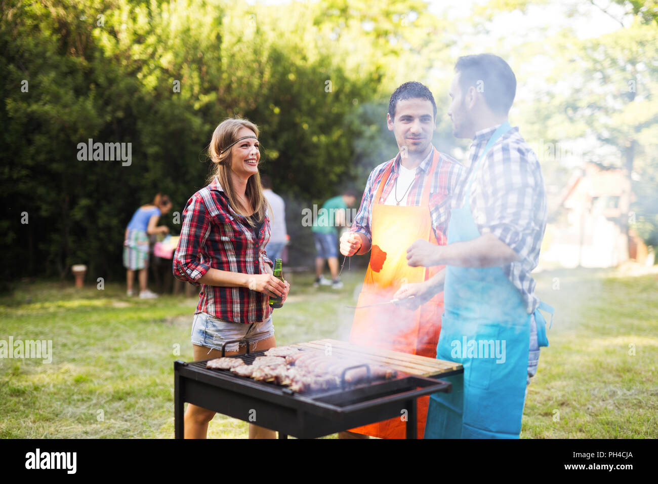 Friends having fun in nature Stock Photo - Alamy