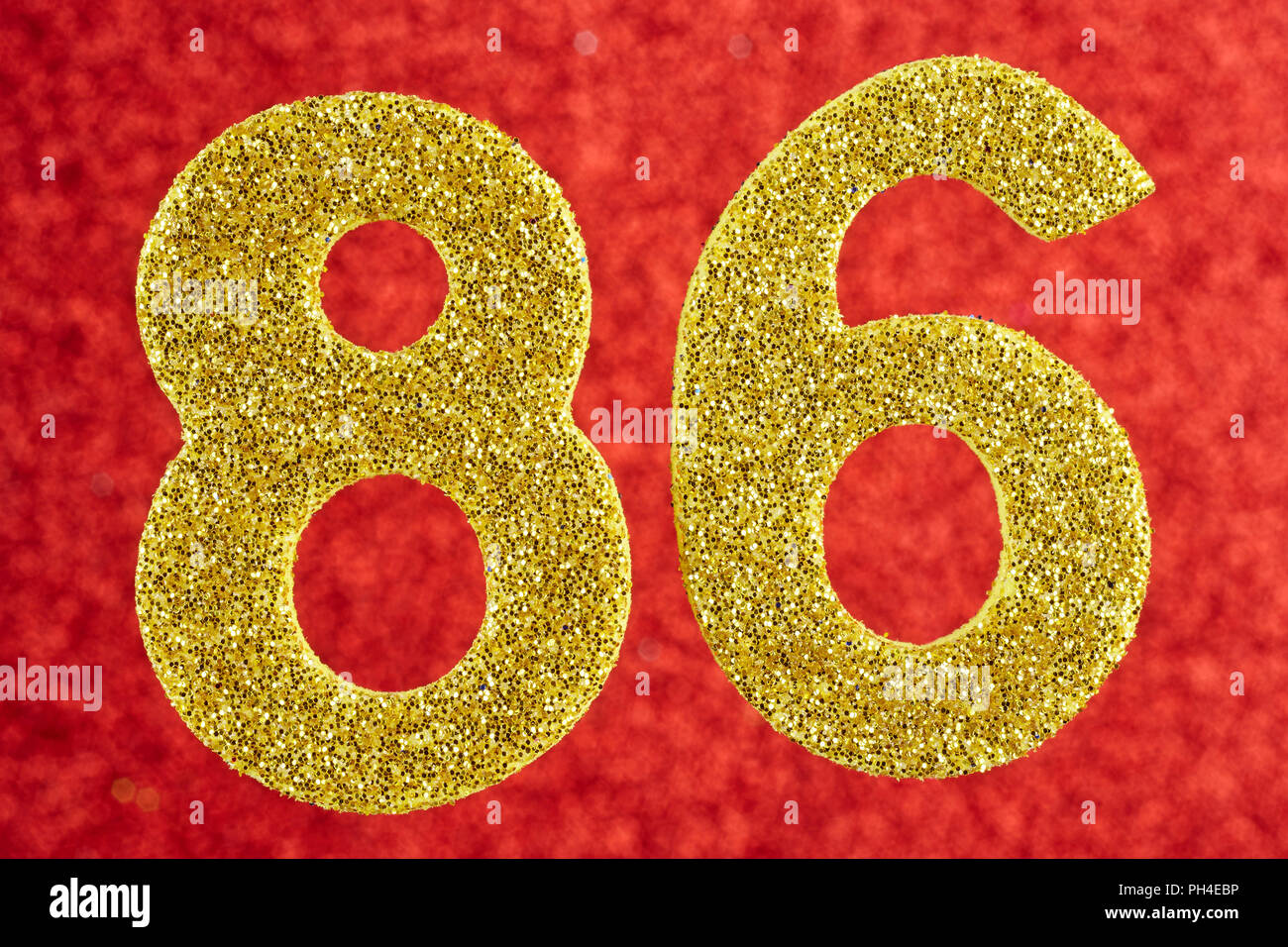 Number eighty-six gold color over a red background. Anniversary ...