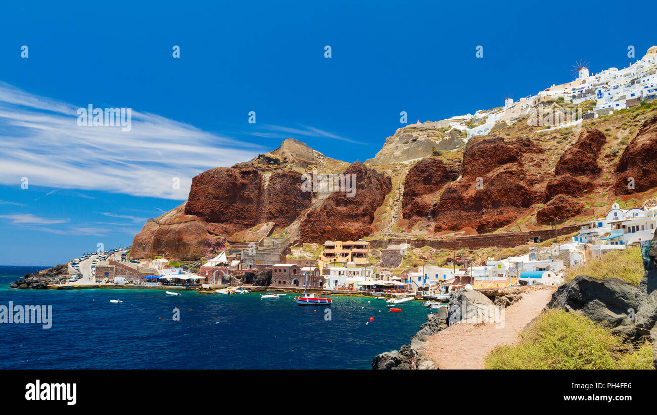 Old port of Oia village at Santorini island in aegean sea Stock Photo ...
