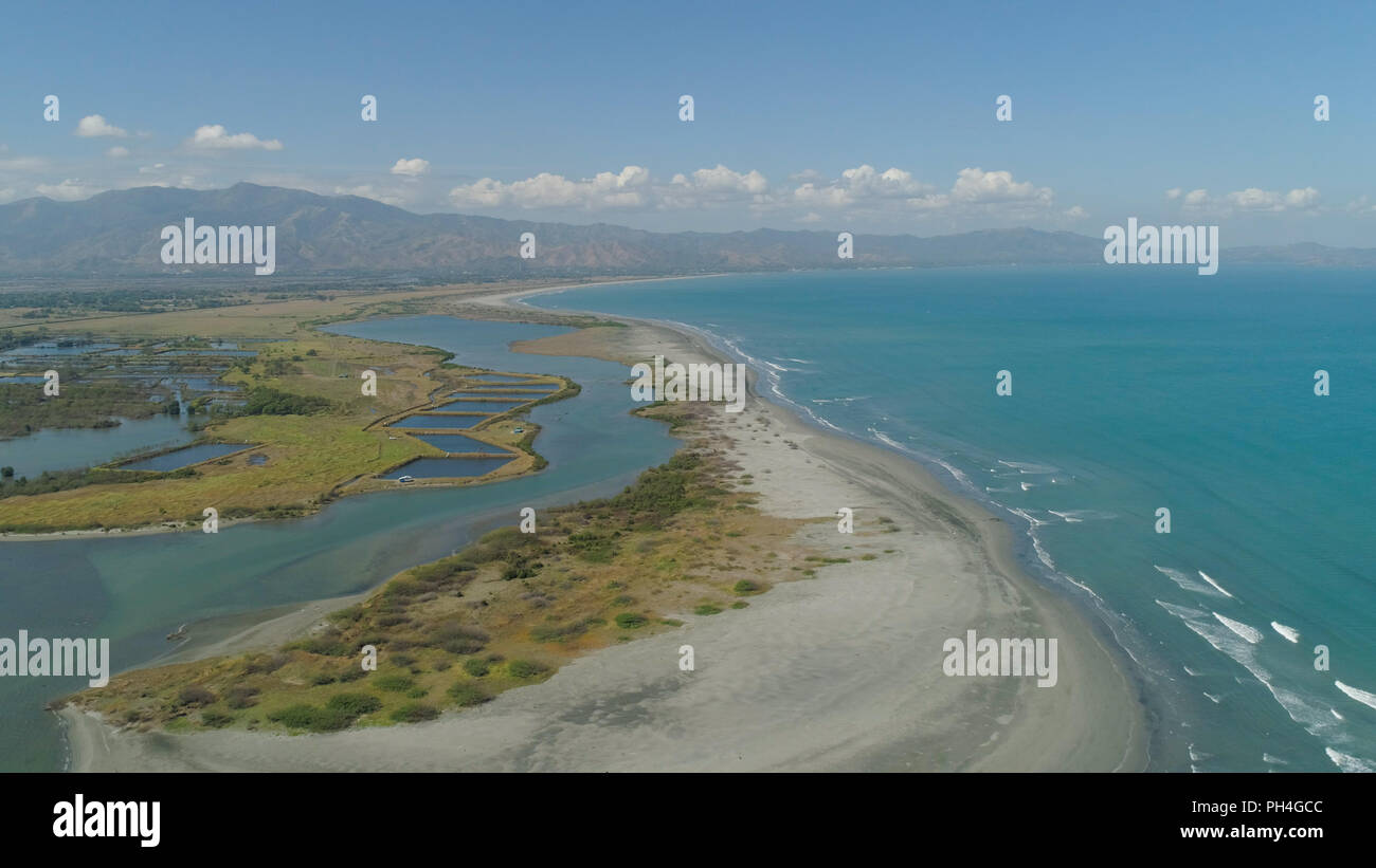 Aerial view of sandy beach Lingayen with azure water on the island ...