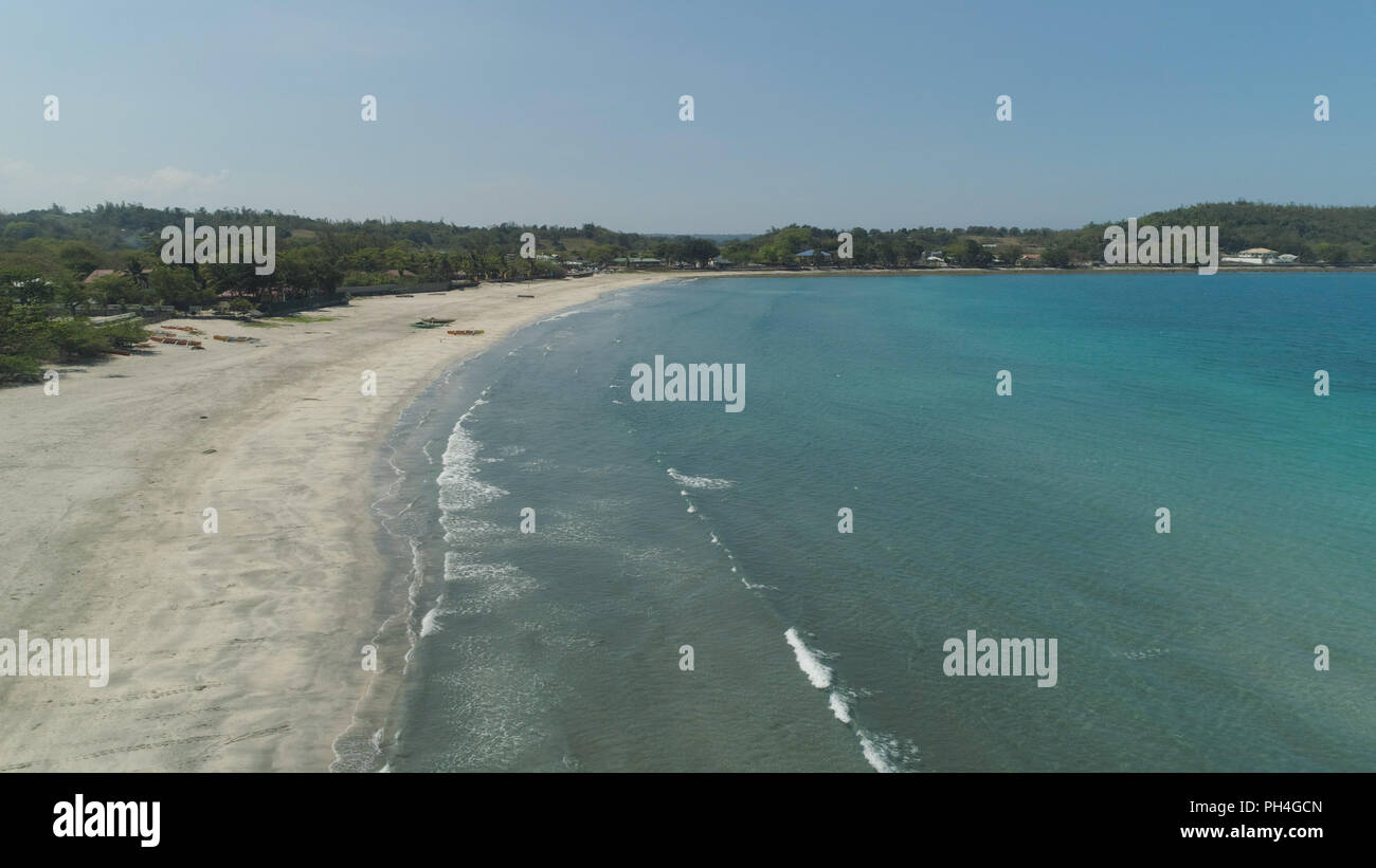 Beautiful tropical beach Cabugao with white sand and palm trees in the ...