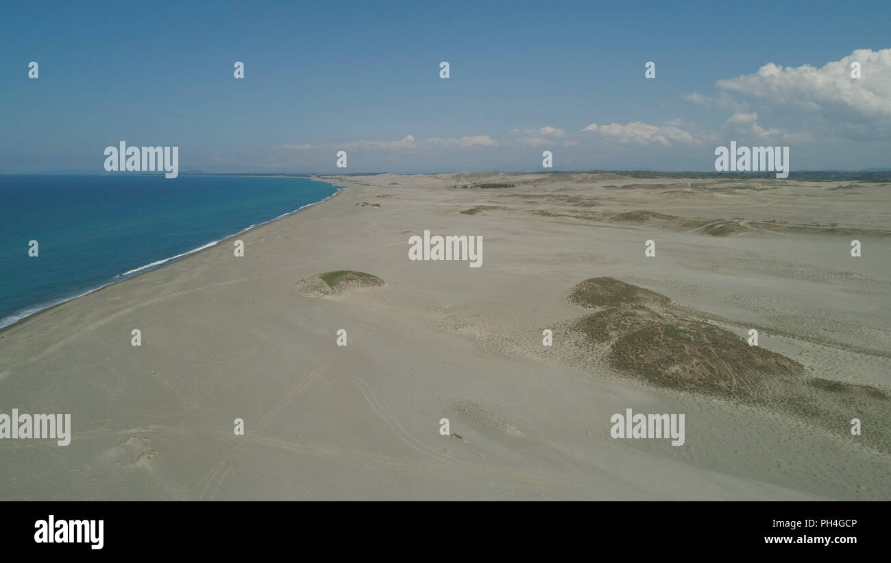 Aerial view of beautiful lonely beach and Paoay sand dune. Philippines ...