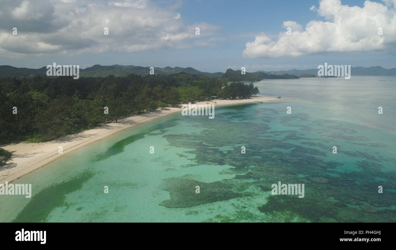Aerial view of beautiful tropical beach with turquoise water in blue ...