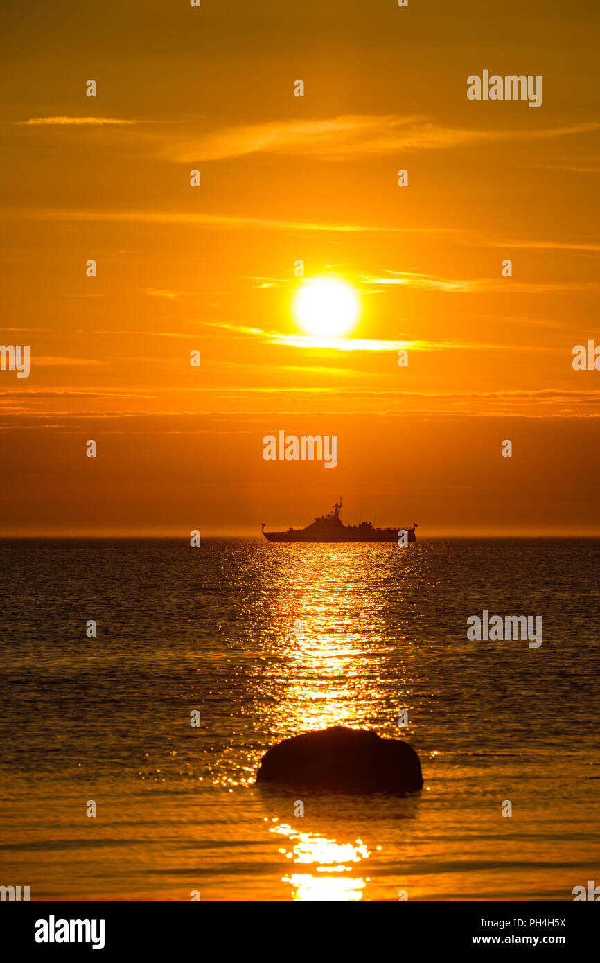Sunset beach with large ship silhouette hi-res stock photography and ...