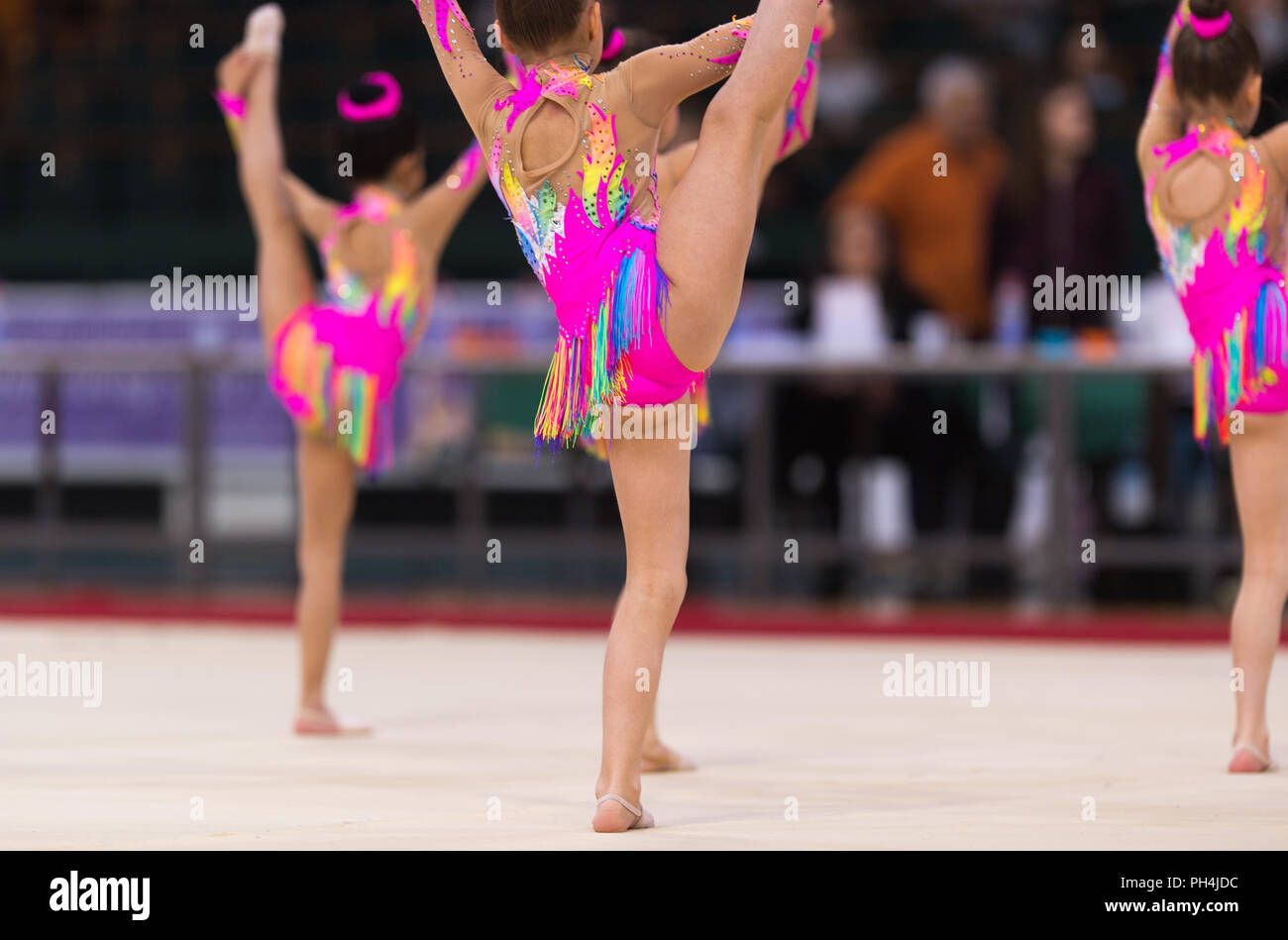 Girl in beautiful gymnastic dress doing exercise Stock Photo - Alamy