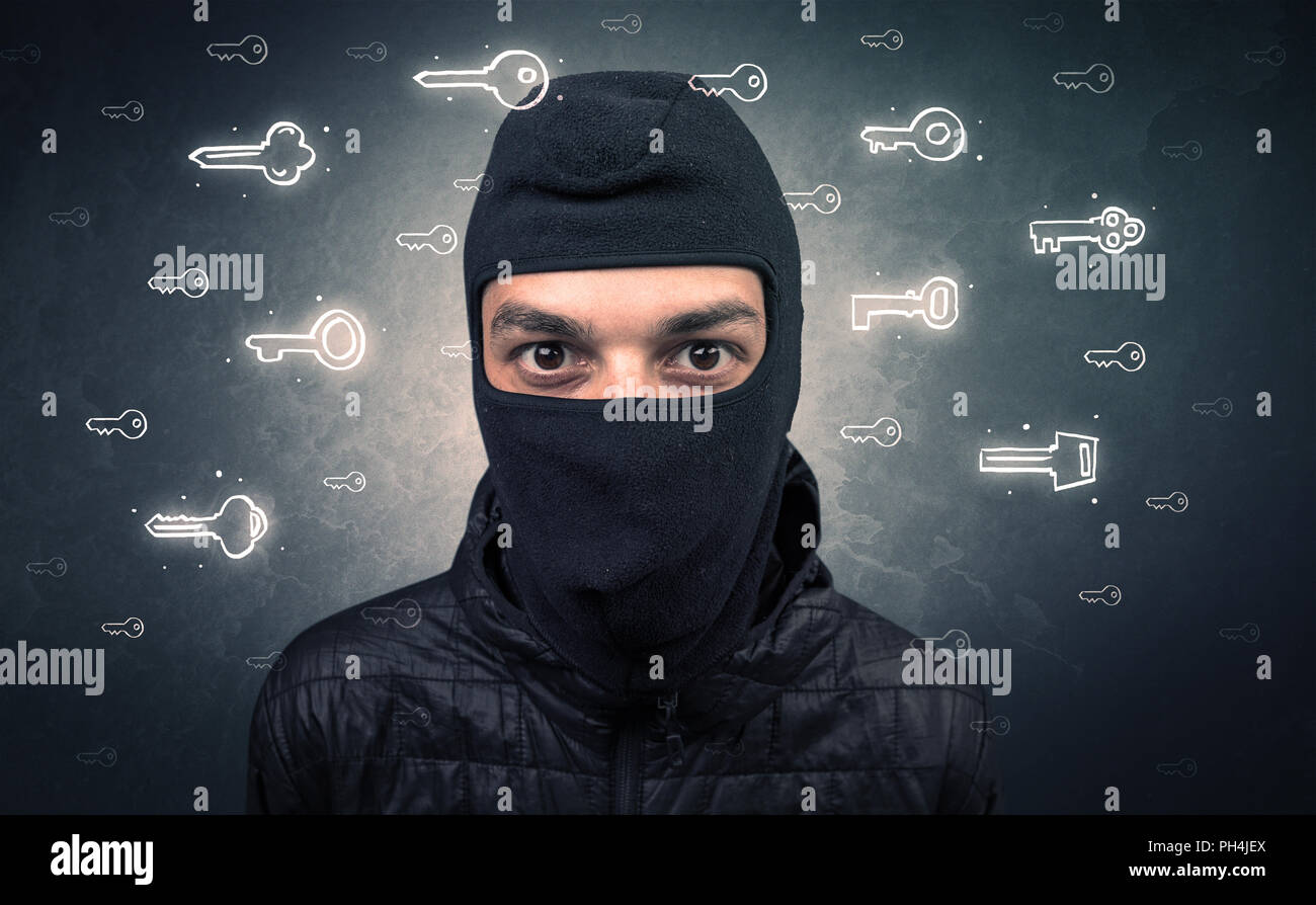 Burglar standing with tools in his hand Stock Photo - Alamy