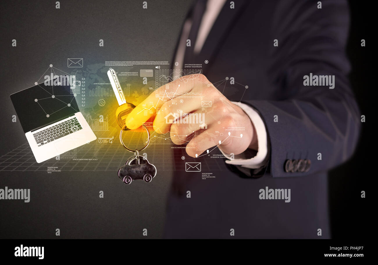 Businessman in suit holding keys with statistics, graphs and icons ...