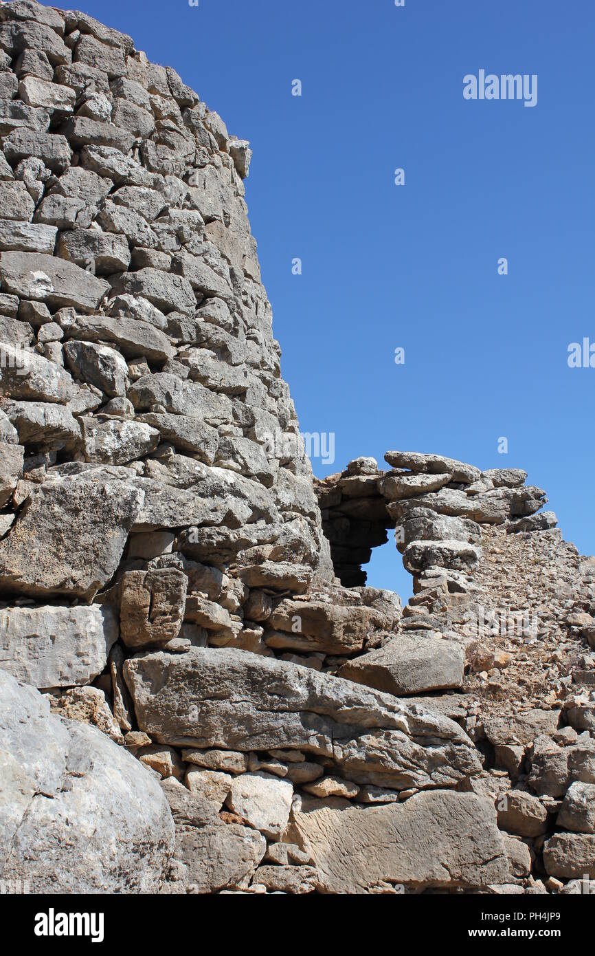 Nuraghe is a typical ancient rock building of the Sardinia island ...