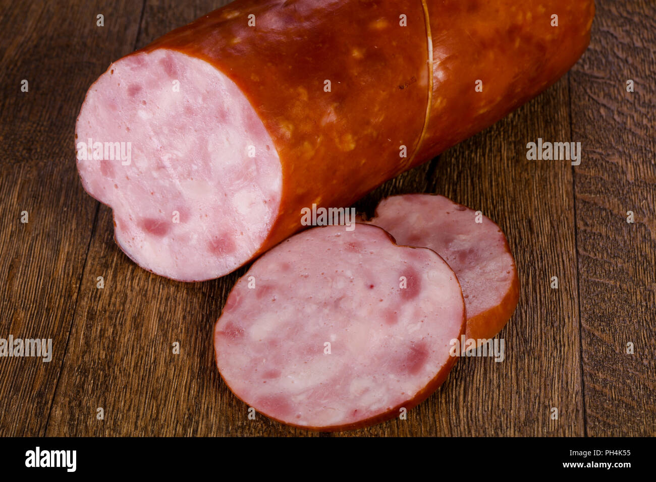 Pork sausages over wooden background Stock Photo - Alamy