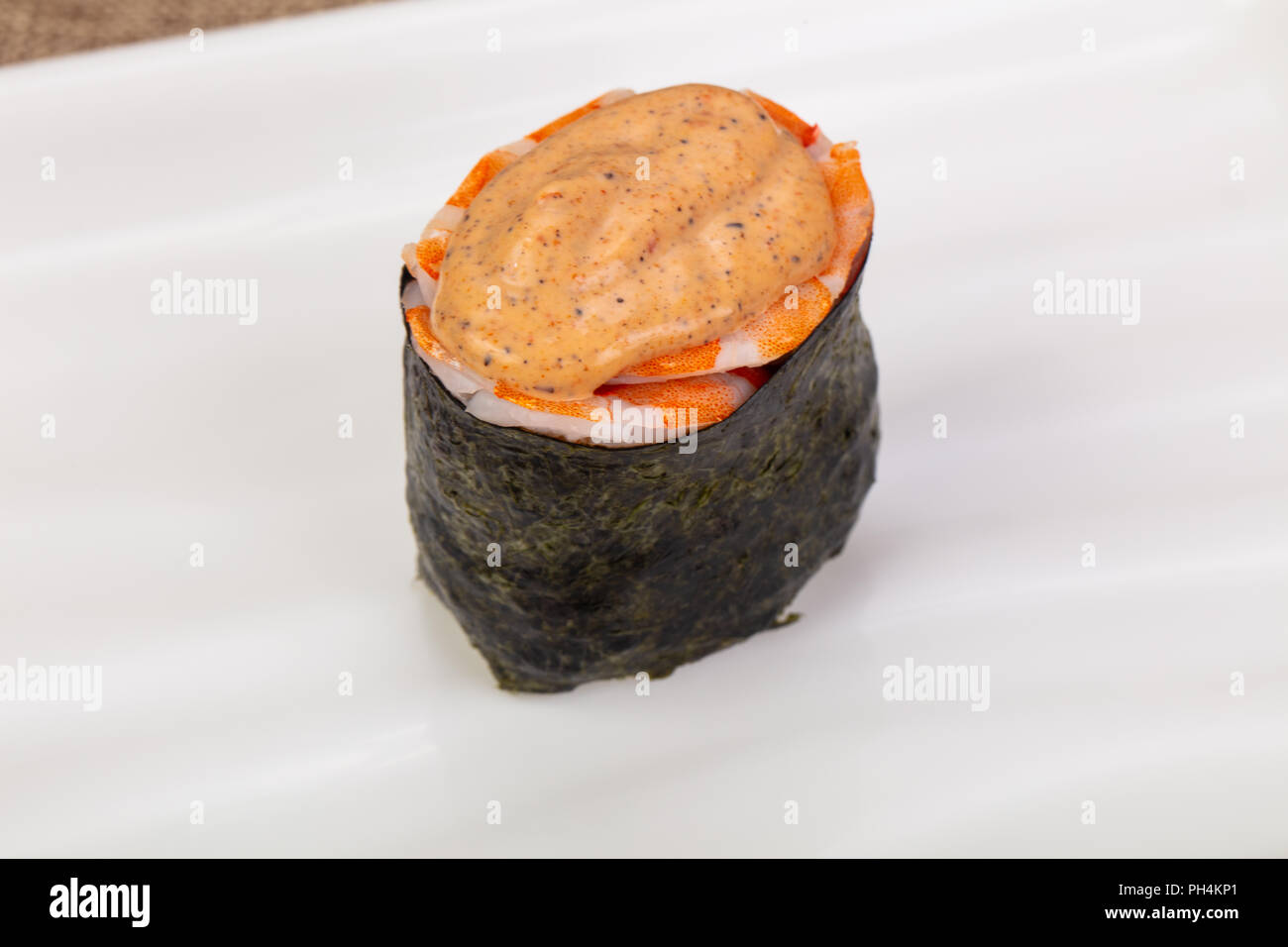 Spicy gunkan sushi with sauce Stock Photo - Alamy