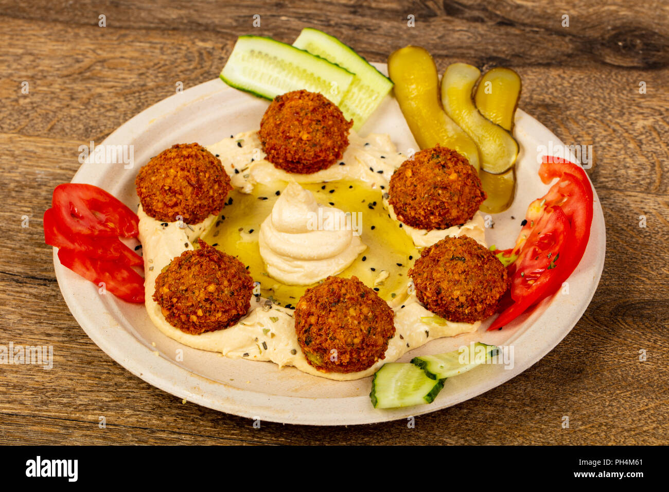 Humus with falafel and olive oil Stock Photo - Alamy