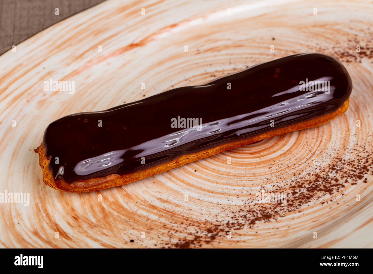 Sweet Eclair with chocolate cream Stock Photo - Alamy