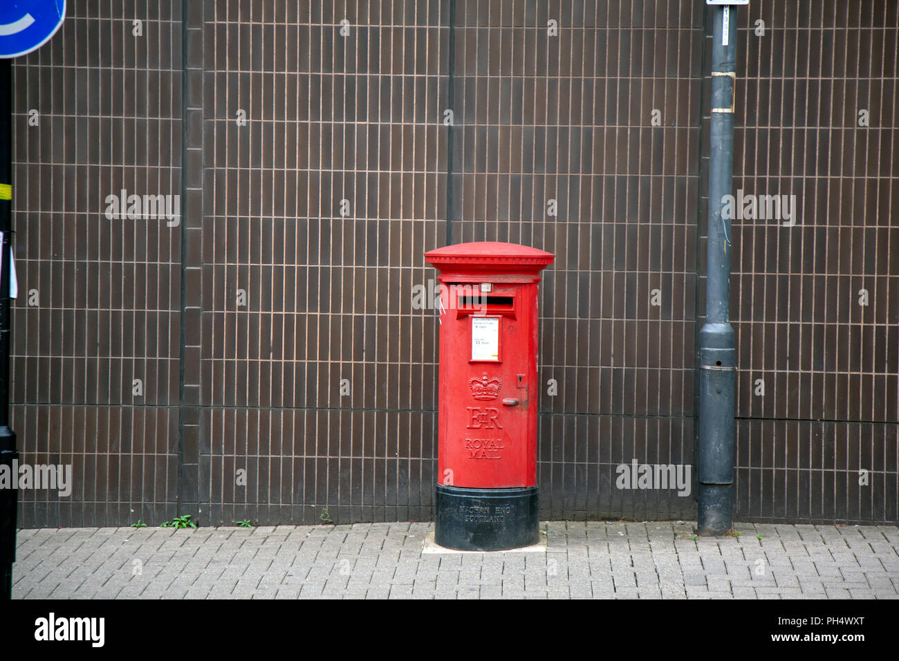 Red pillar box style letter box on a street in Sheffield, South ...