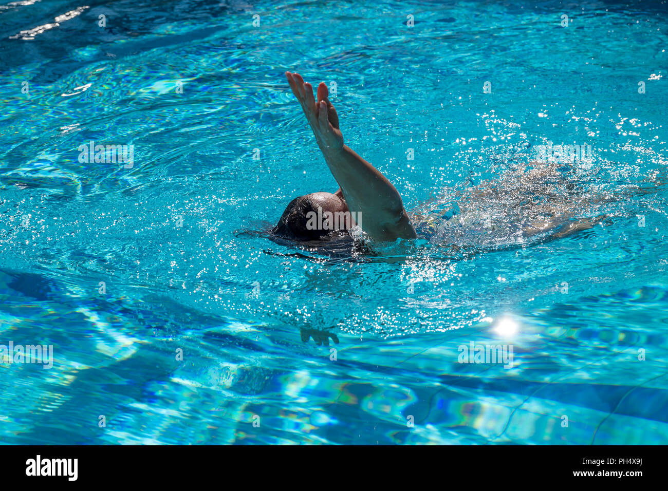 Woman Swimming Backstroke in Swimming Pool in Switzerland Stock Photo ...