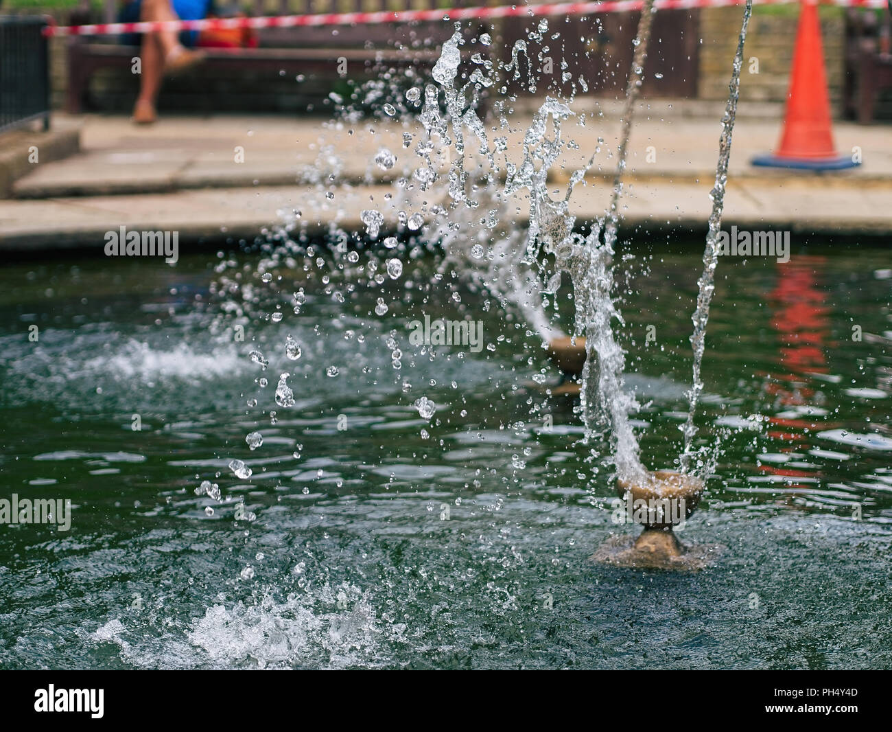 Splashing water in the garden. Fountain water background Stock Photo ...
