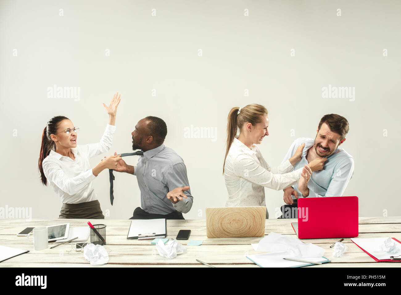 Winners. Young african and caucasian men and women sitting at office ...