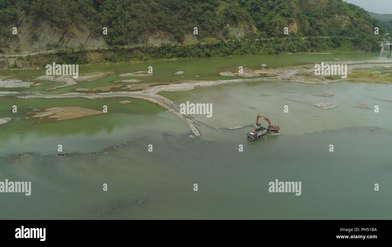 Aerial view of Excavator and heavy equipment, dredging and deepening ...