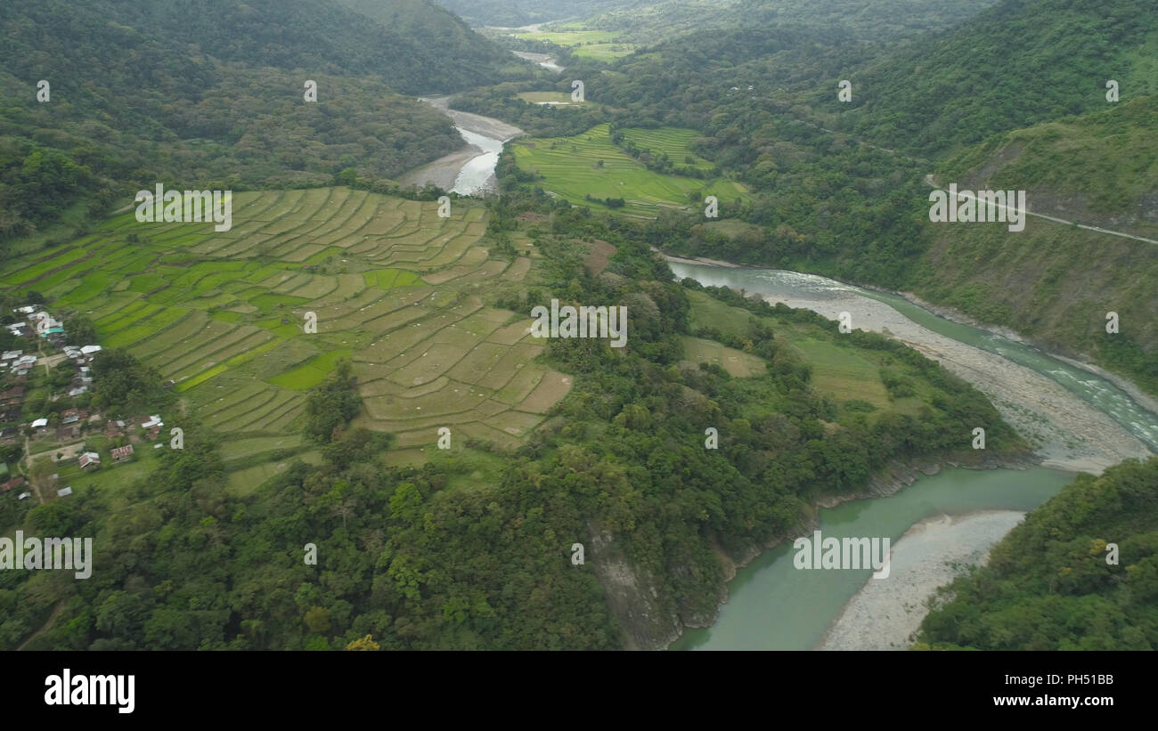 Aerial view of mountain valley in the cordillera, river, rice terraces ...